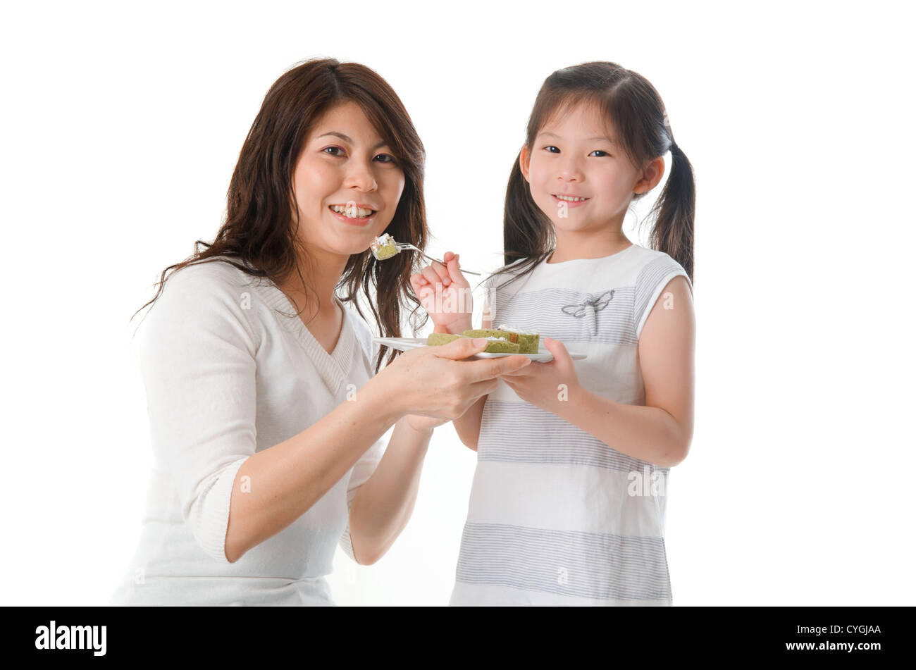 asian daughter feeding her mother, bonding Stock Photo - Alamy