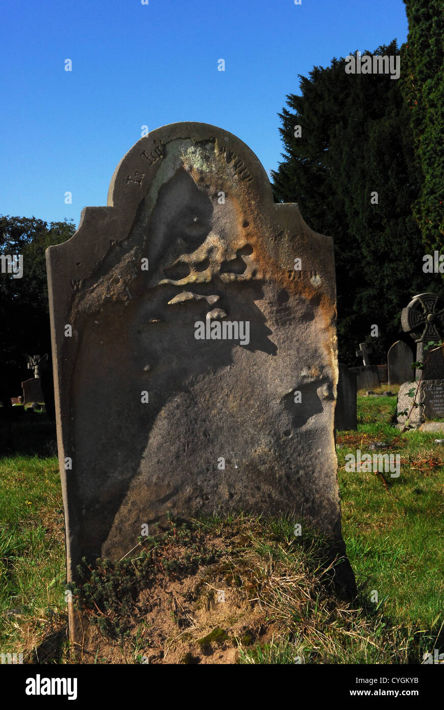 eroded gravestone in cemetery autumn Stock Photo - Alamy