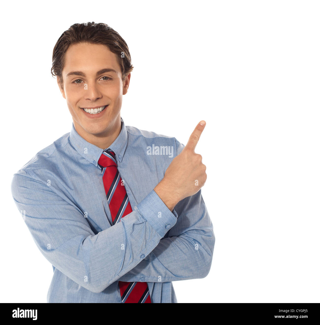 Business male pointing upwards and smiling at camera Stock Photo - Alamy