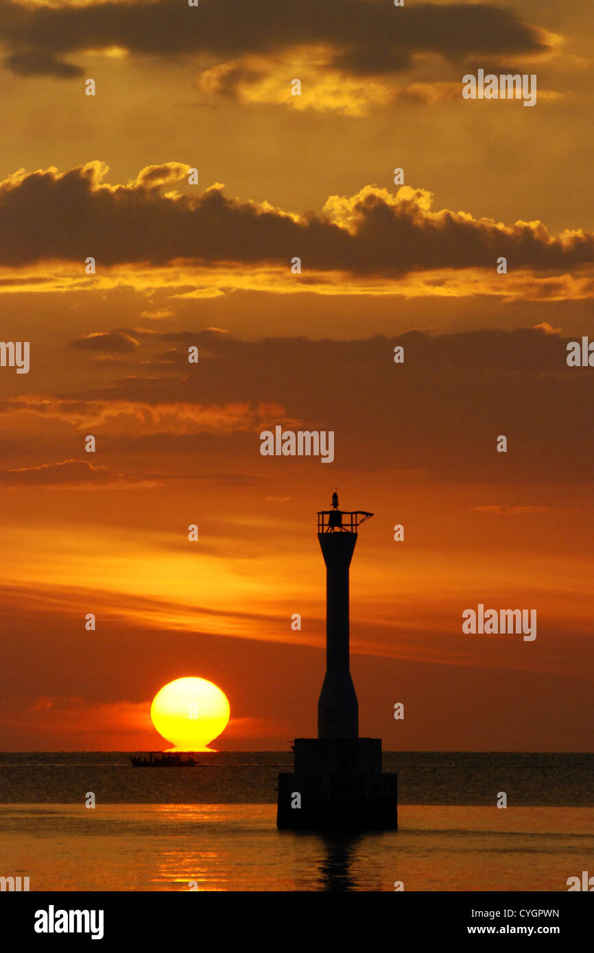 sunset over a lighthouse from southeast asia Stock Photo - Alamy