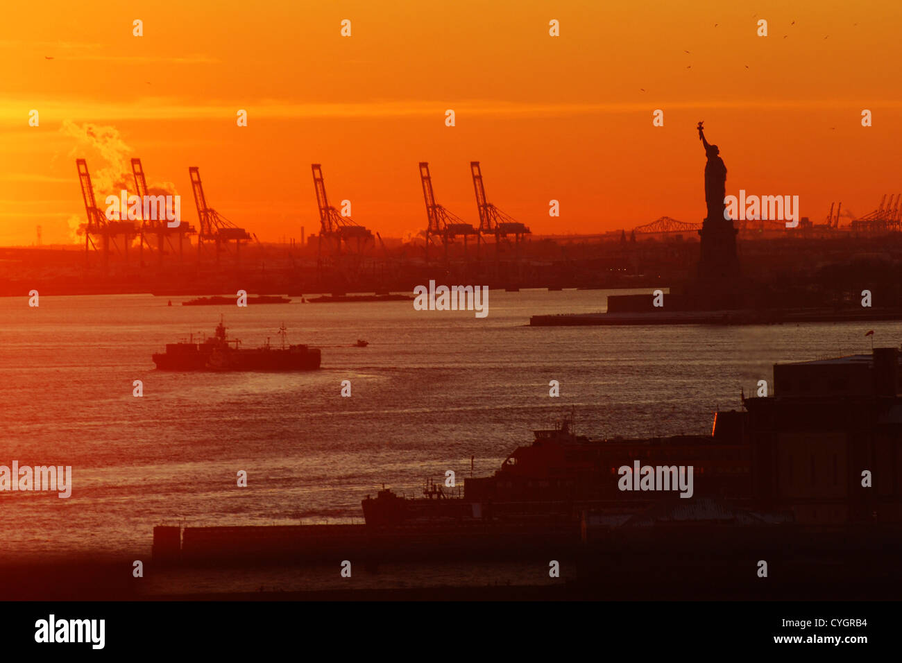 statue of liberty from new york during sunset Stock Photo - Alamy