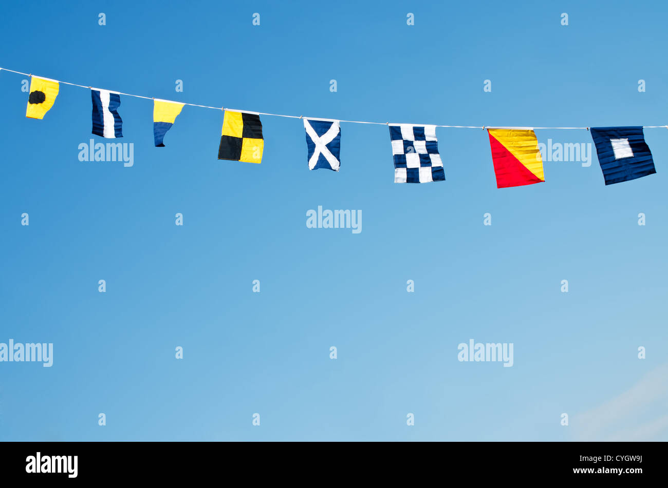 Nautical flags against blue sky Stock Photo - Alamy