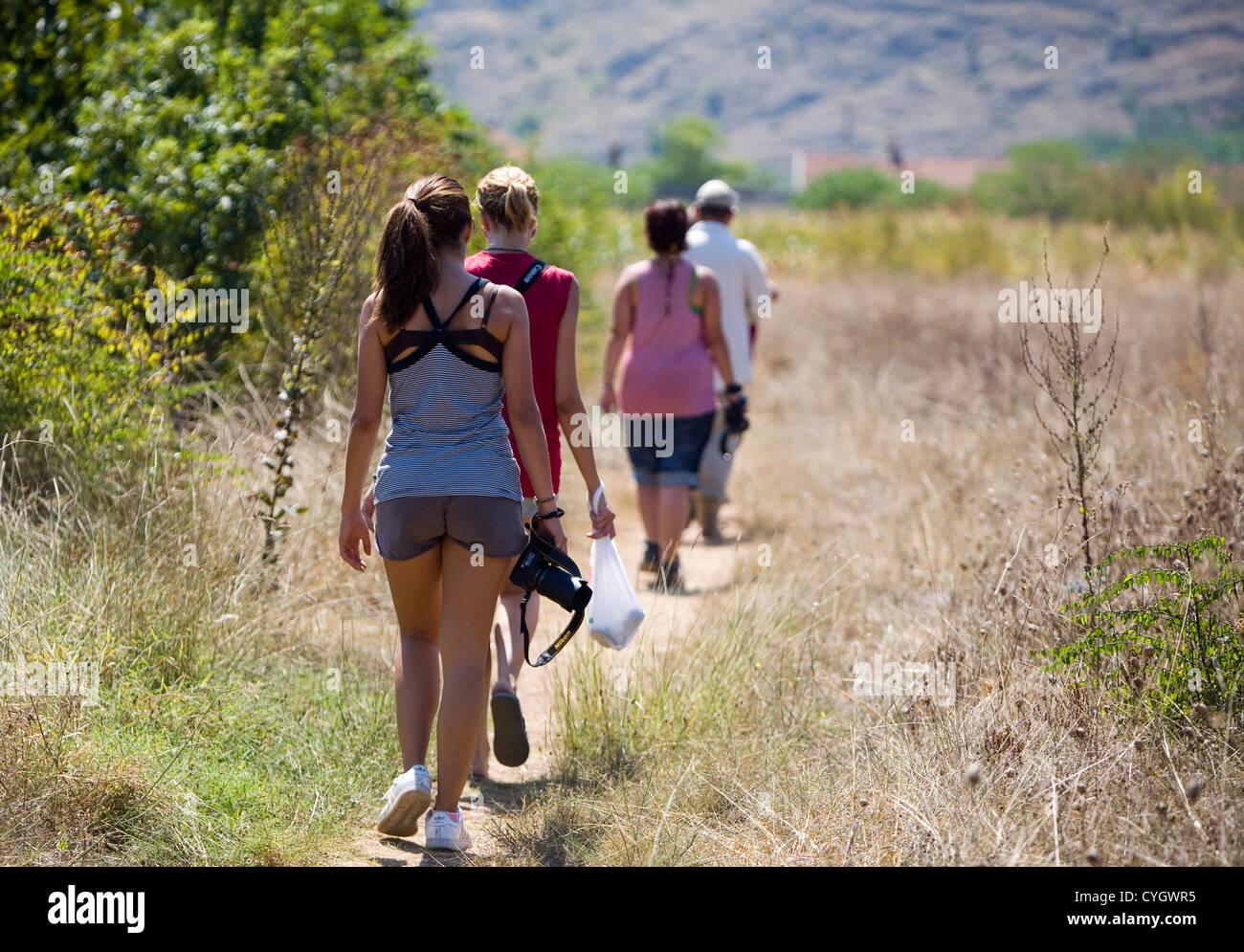 People walking at the countryside Stock Photo - Alamy