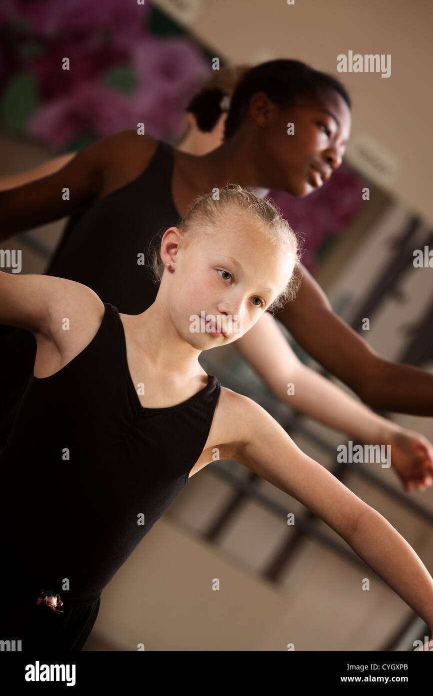 Two young ballet students concentrate in class Stock Photo - Alamy