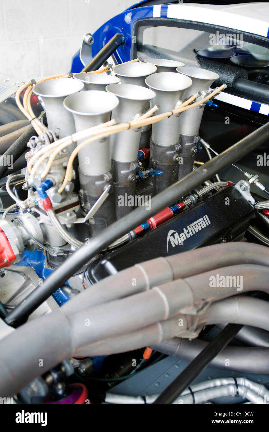 A V8 racing engine in the back of a classic racing car Stock Photo - Alamy