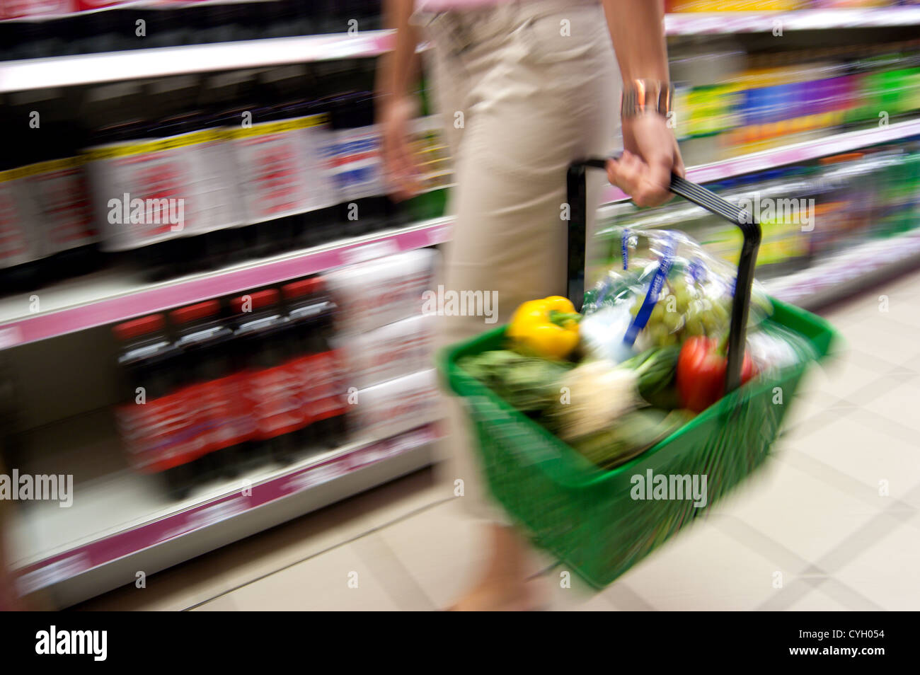 Woman with Full Shopping Basket Stock Photo - Alamy
