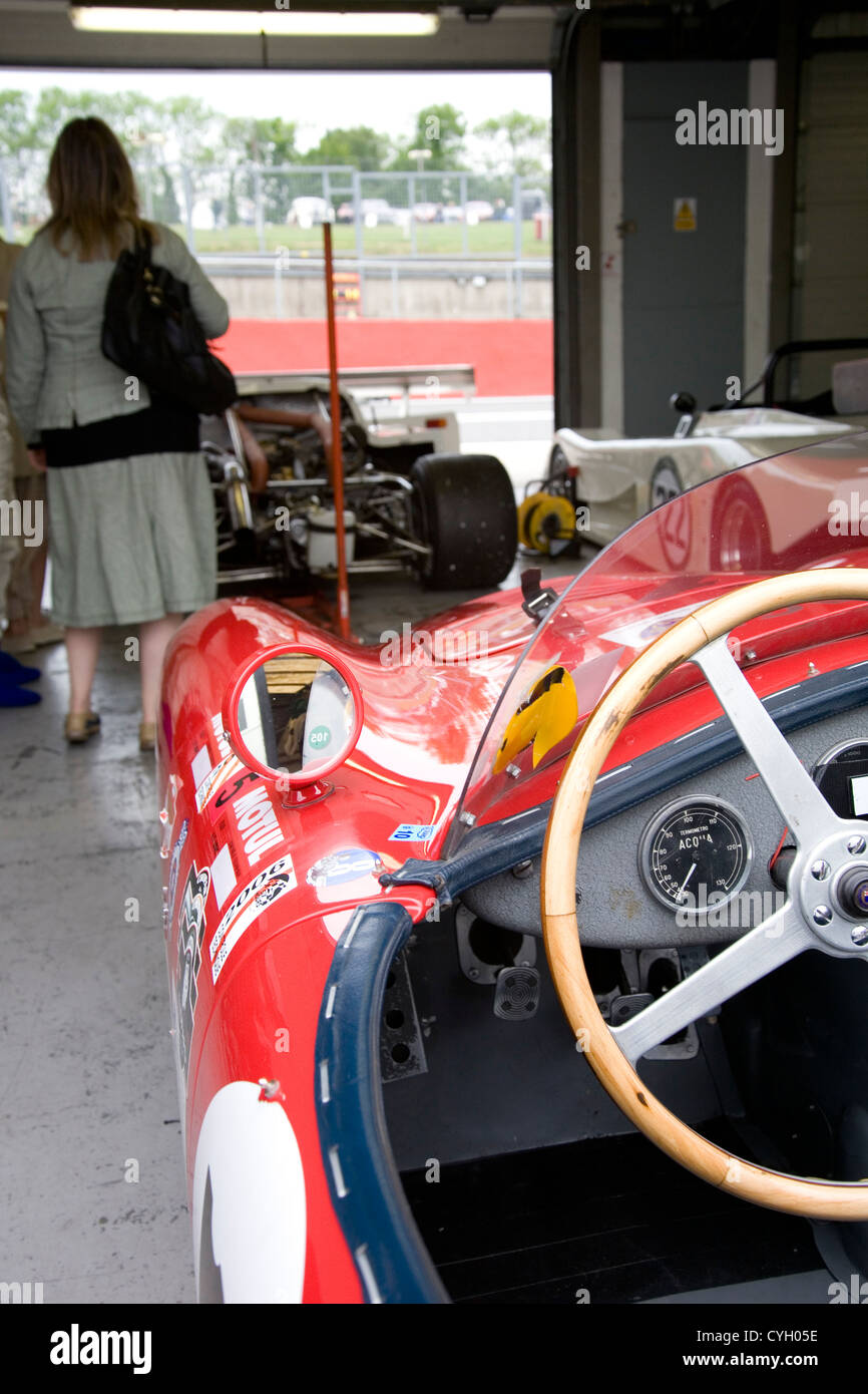 The cockpit of a classic racing car in the pits at a motor circuit ...