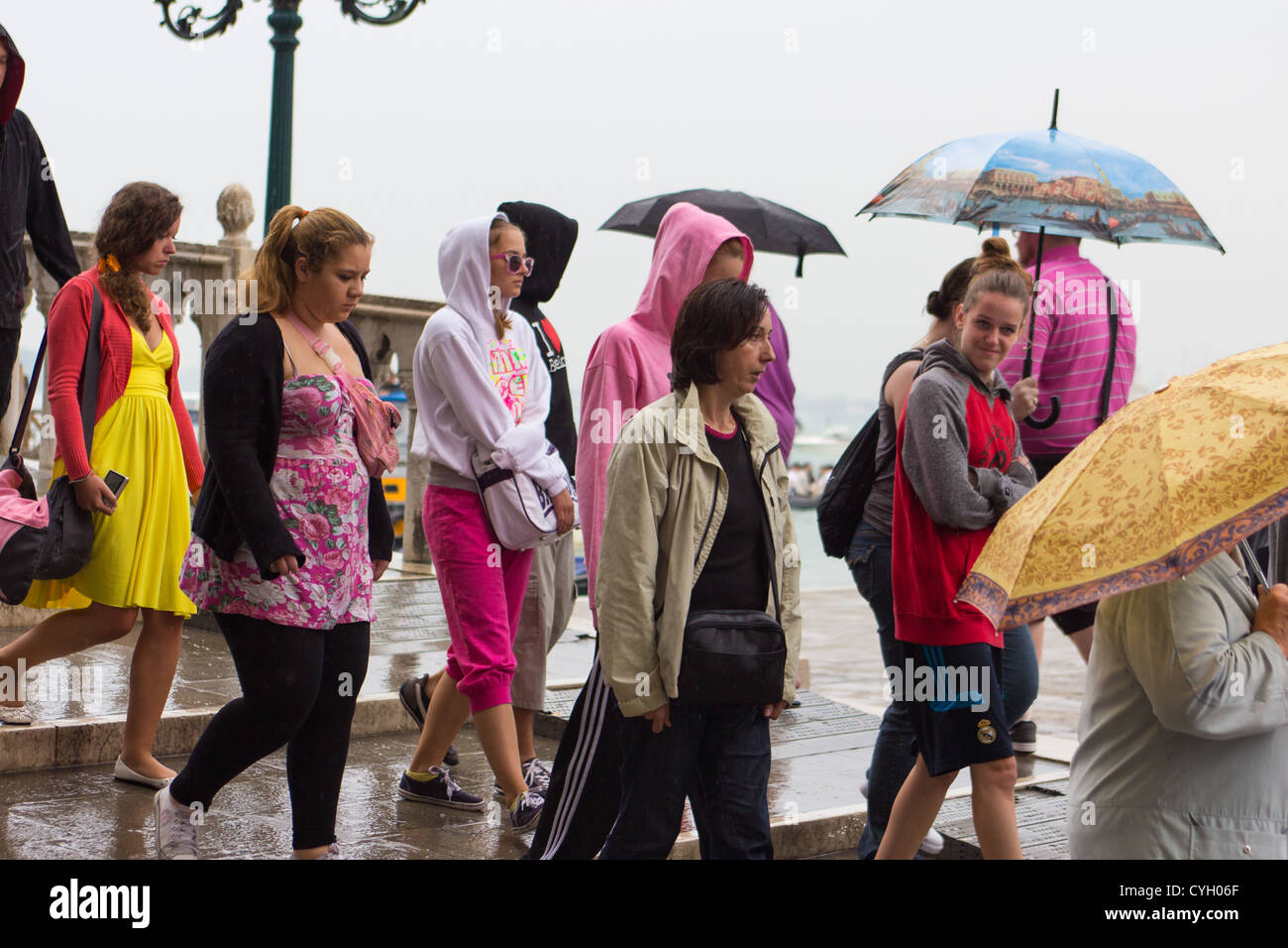 crowds of Tourists in the heavy rain. Venice waterfront.Italy Stock ...