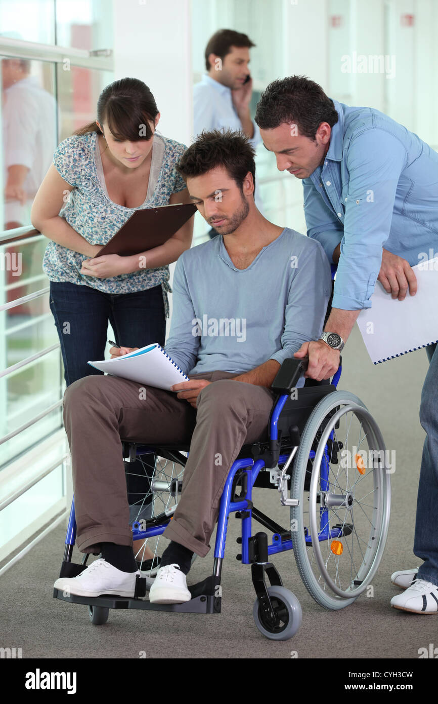 Working man in wheelchair Stock Photo - Alamy