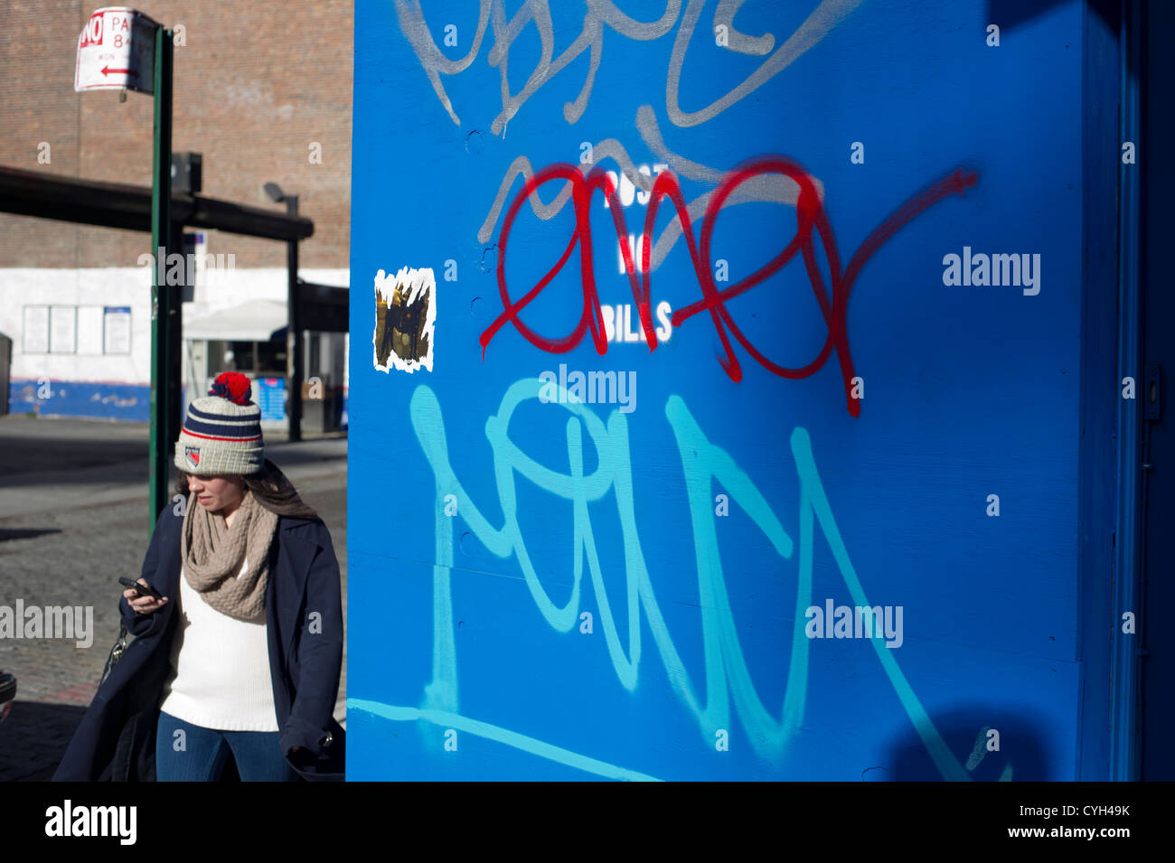 A wall covered with graffiti seen in the trendy Soho neighborhood of ...