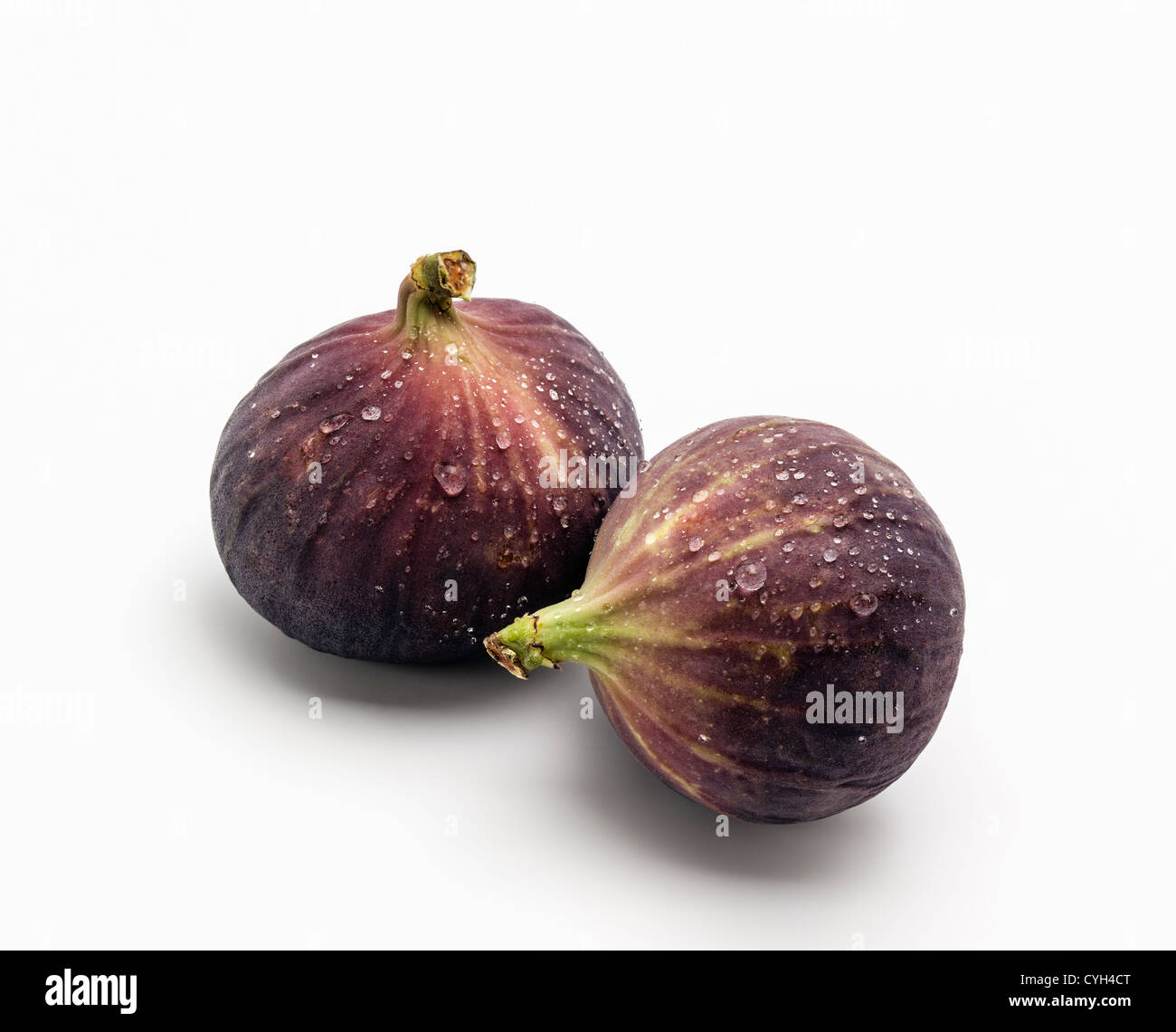Two fresh Figs on white background Stock Photo - Alamy