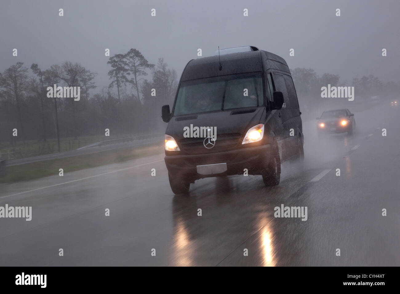 Mercedes Sprinter van driving in a rain storn on Interstate highway 10 ...
