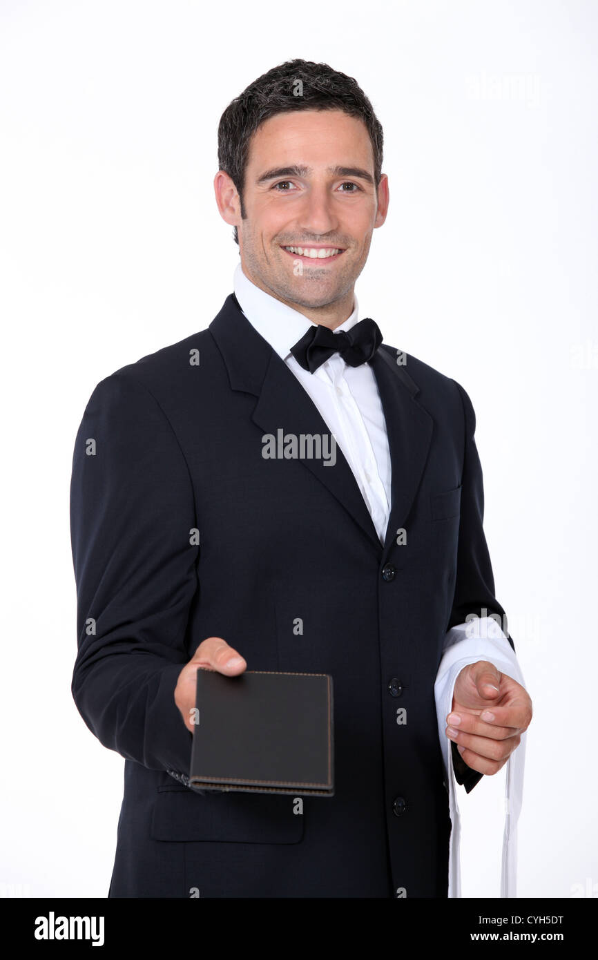 Well dressed waiter holding menu hi-res stock photography and images ...