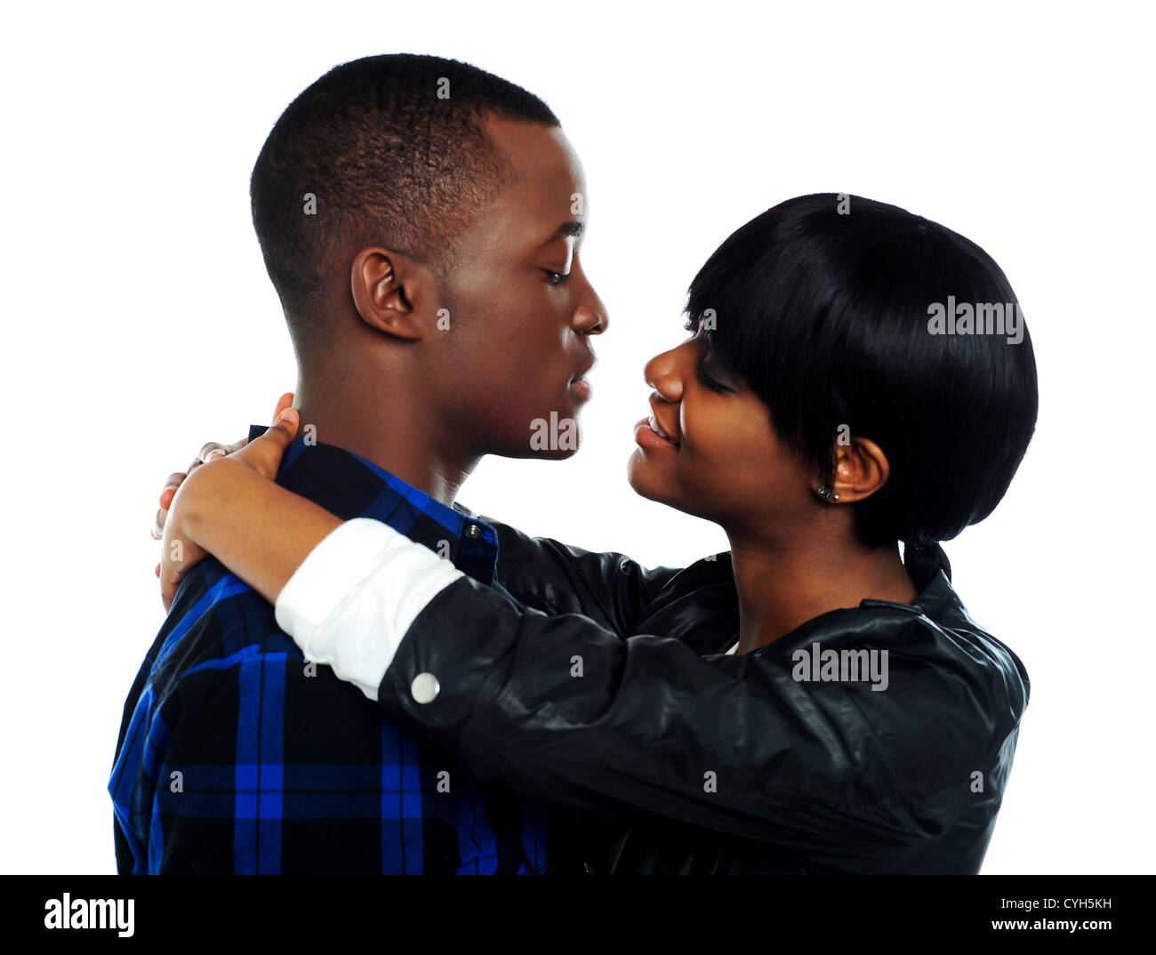 Young affectionate african couple hugging. Isolated over white ...