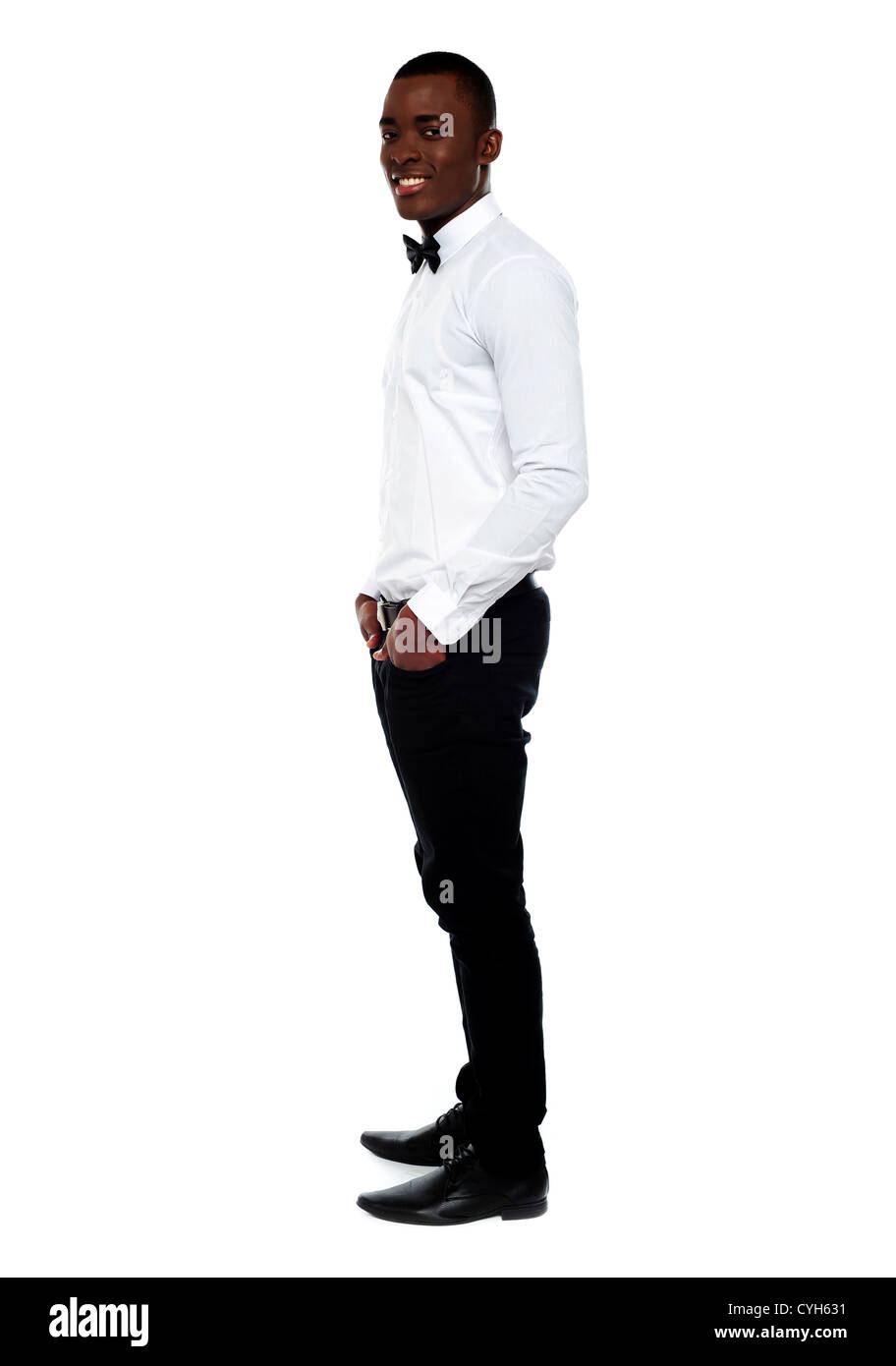 Full length view of smart young man. Side pose against white background ...