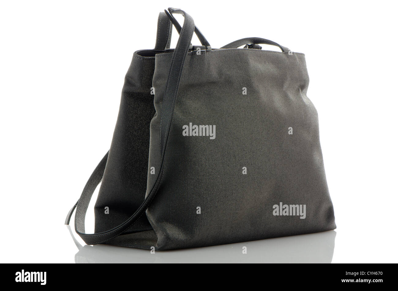 Shoulder bag on white reflective background Stock Photo - Alamy