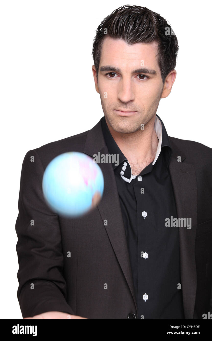 Man bouncing ball in the world Stock Photo - Alamy