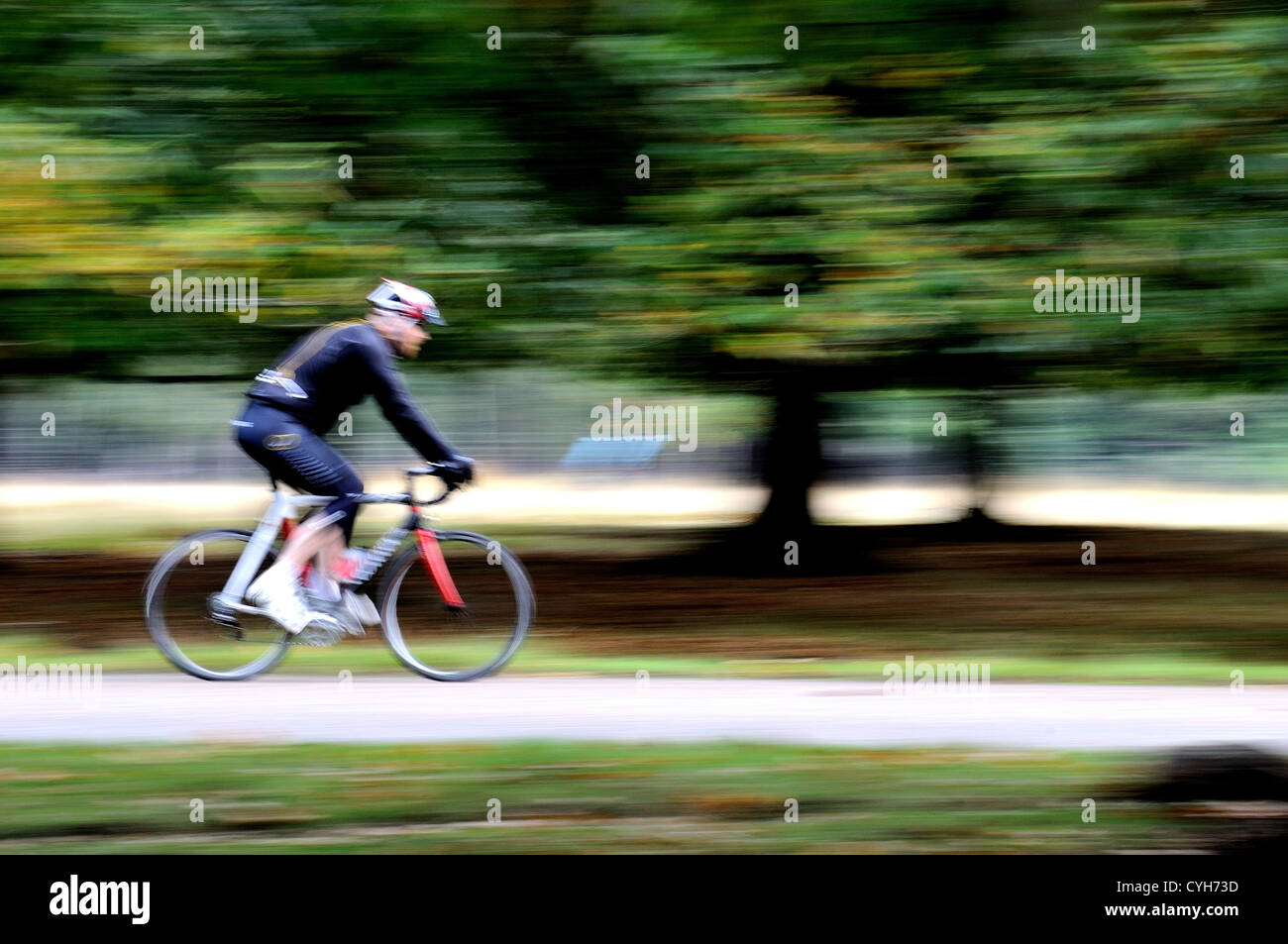 Fast moving cyclist in countryside with blurred background Stock Photo ...