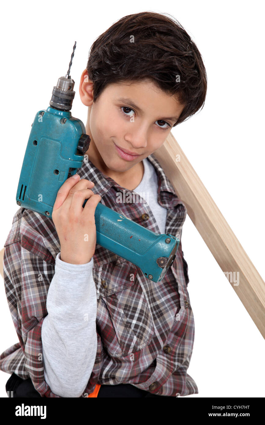 Young boy pretending to be a tradesman Stock Photo - Alamy