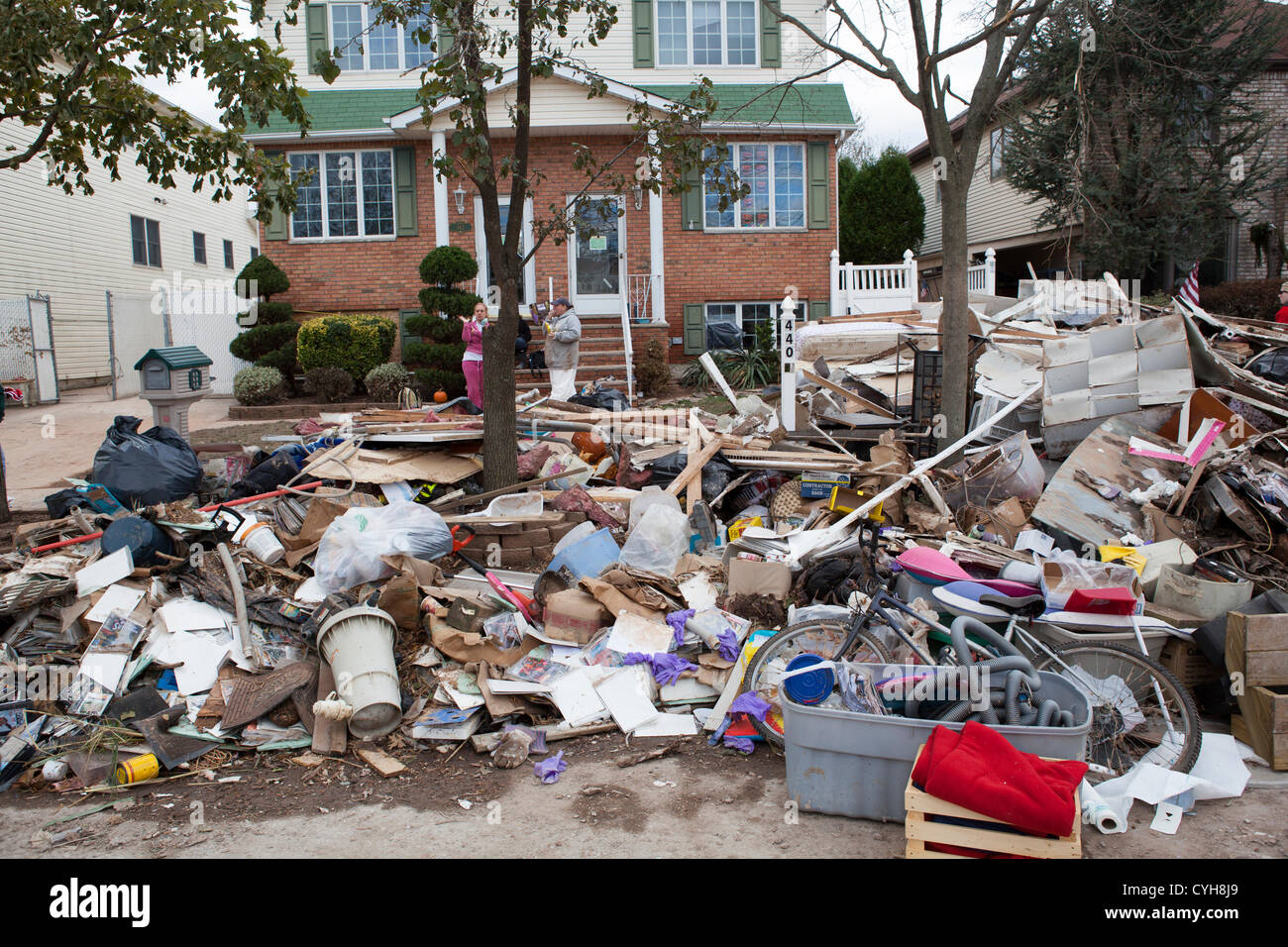 Nov. 4, 2012. Piles of damaged household items are piled in the front ...