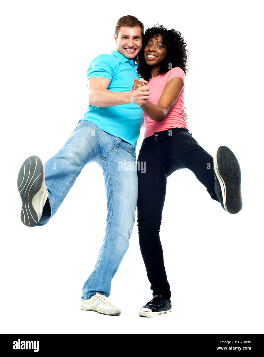 Dancing couple having fun. Showing legs to camera Stock Photo - Alamy