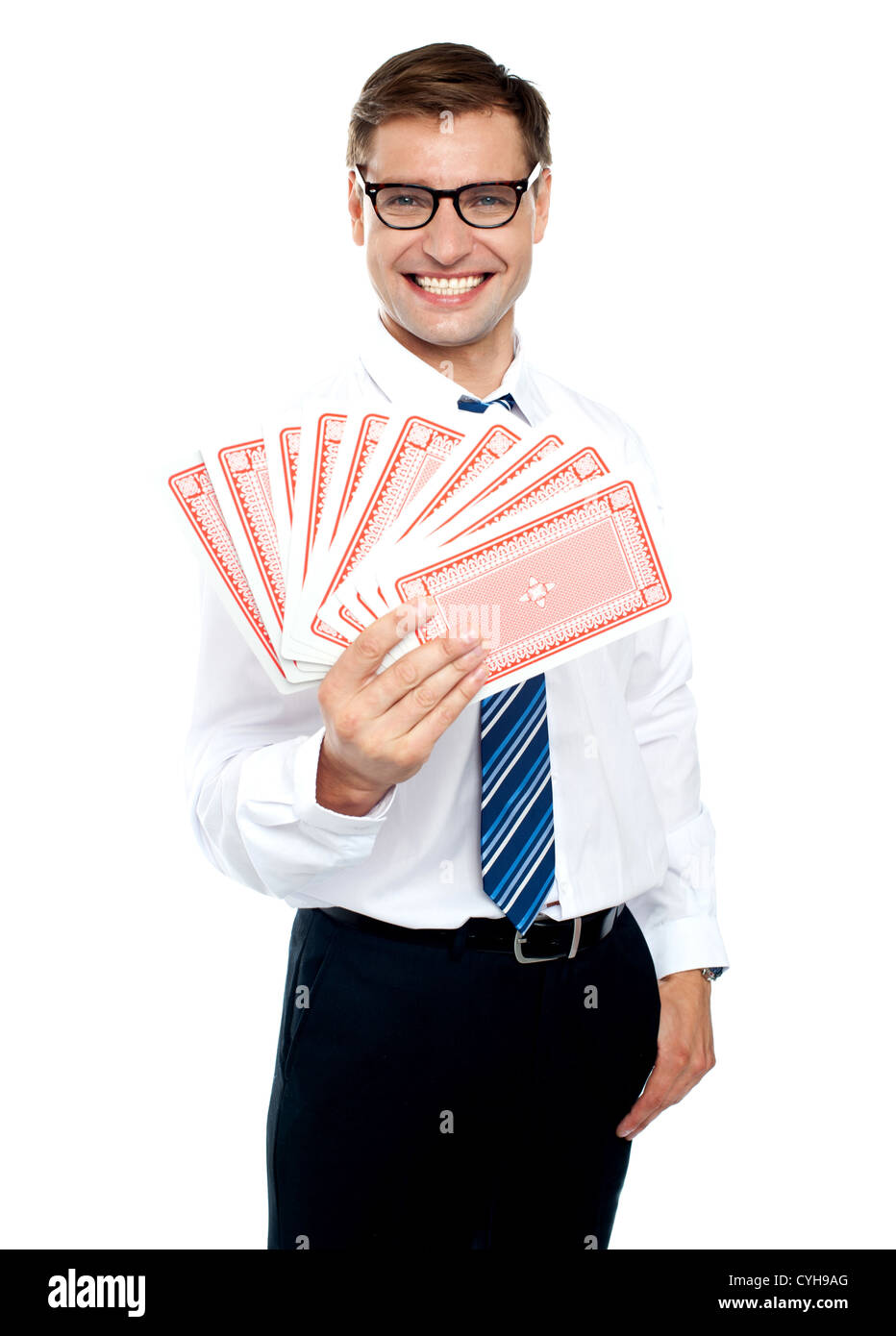 Cheerful man holding up playing cards. All on white background Stock ...