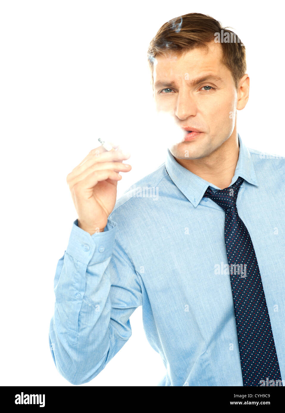 Young businessman smoking cigarette on a white background Stock Photo ...
