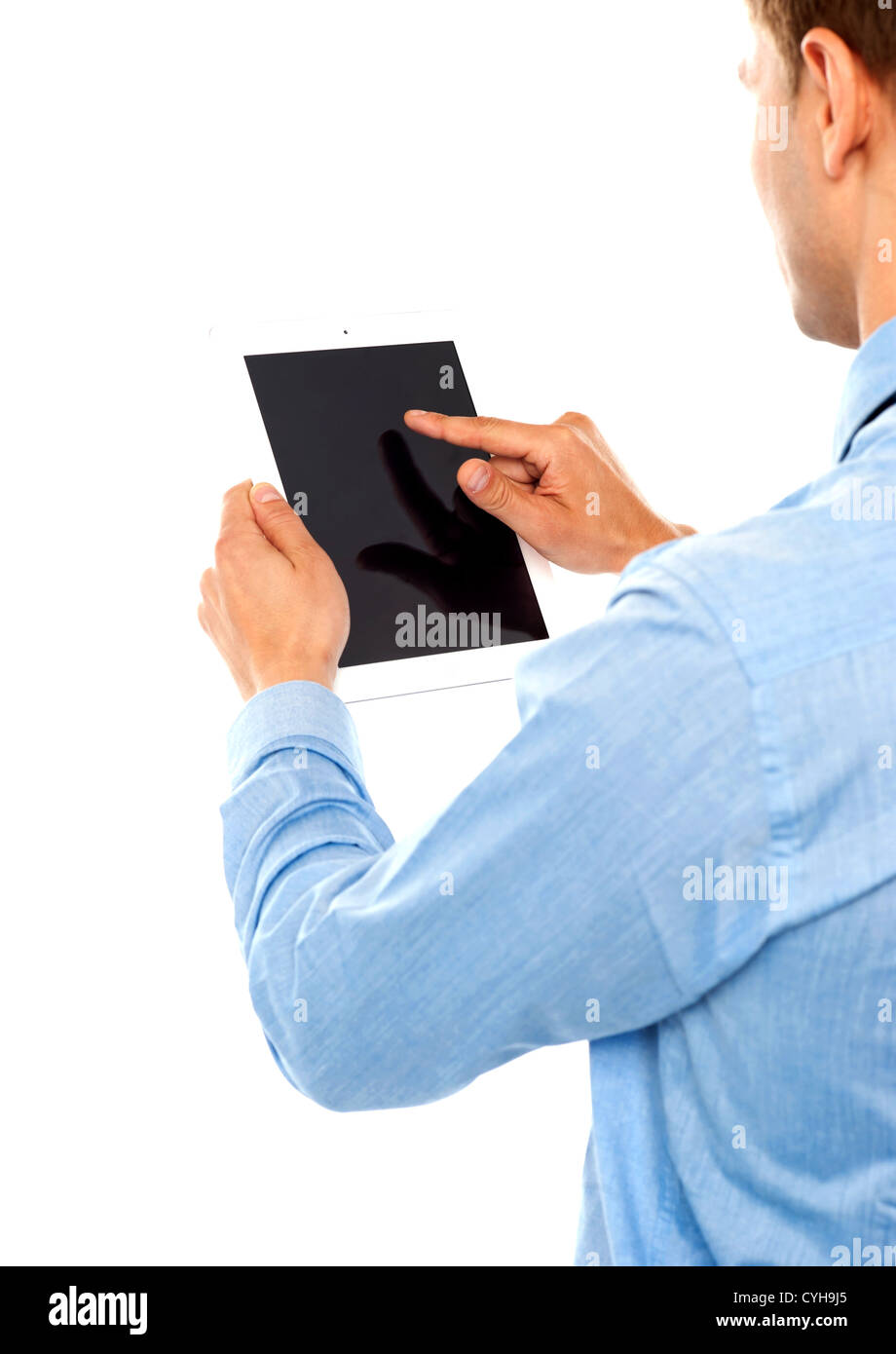 Rear view of a businessman holding wireless touch pad device. Touch ...