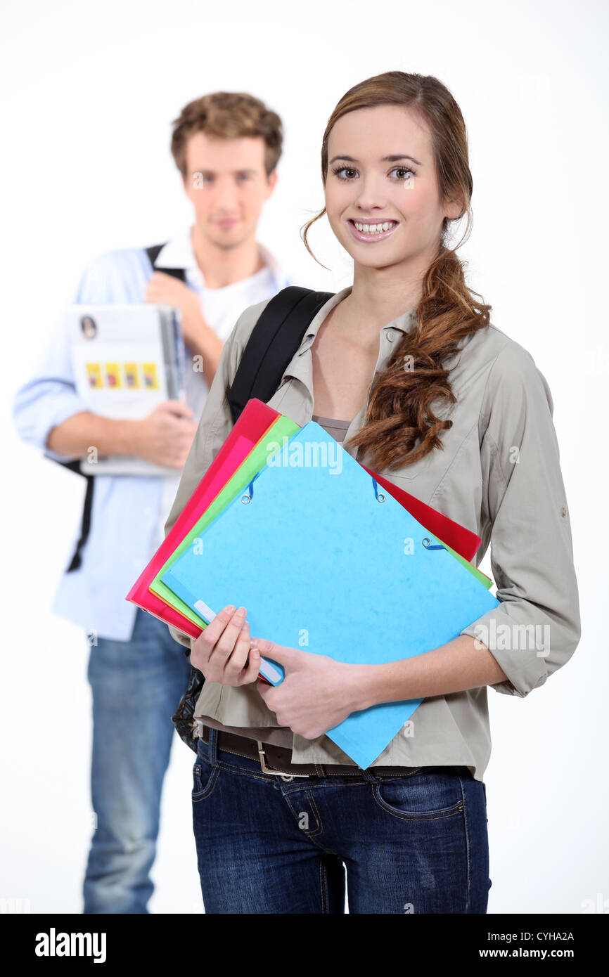 Two students carrying paperwork Stock Photo - Alamy