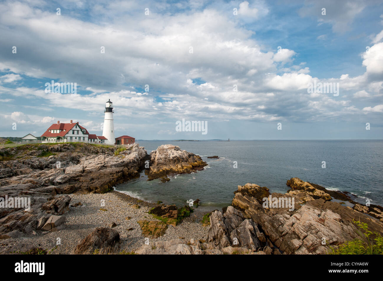 Lighthouse overlooking rocky shore of Cape Elizabeth Maine Stock Photo ...