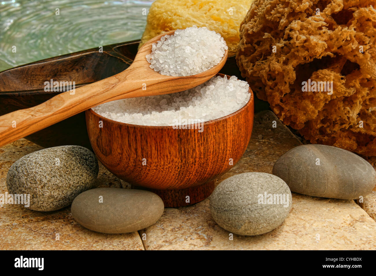 Sea bath salts with river rocks and sponges Stock Photo - Alamy