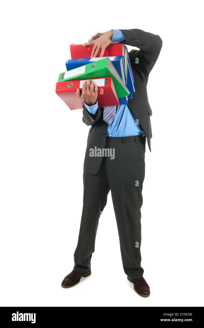 Business man standing in the studio carrying heavy archive Stock Photo ...