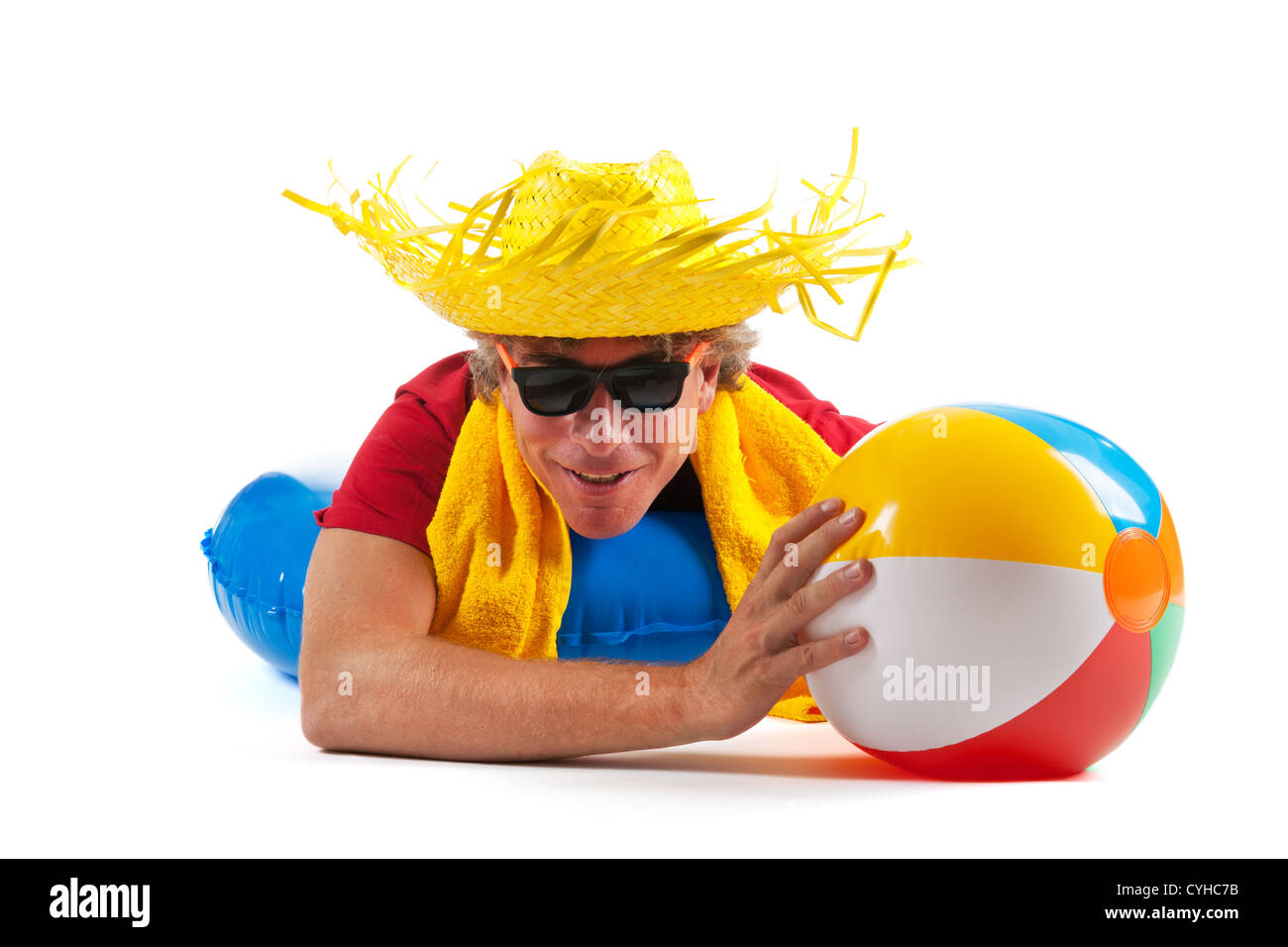 Adult man is laying on a float with beach ball Stock Photo - Alamy