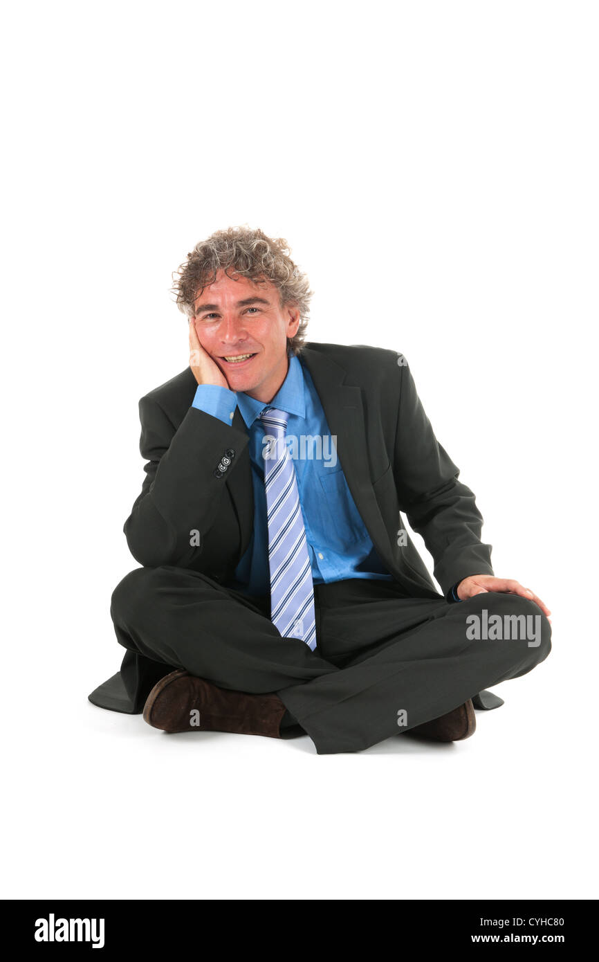 Happy manager is sitting on the floor in studio Stock Photo - Alamy