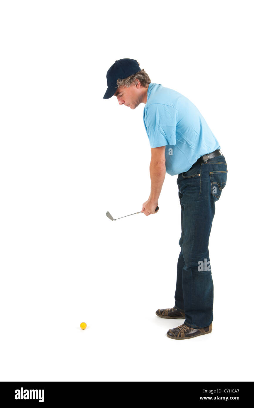 Handsome man playing golf standing in studio isolated on white ...