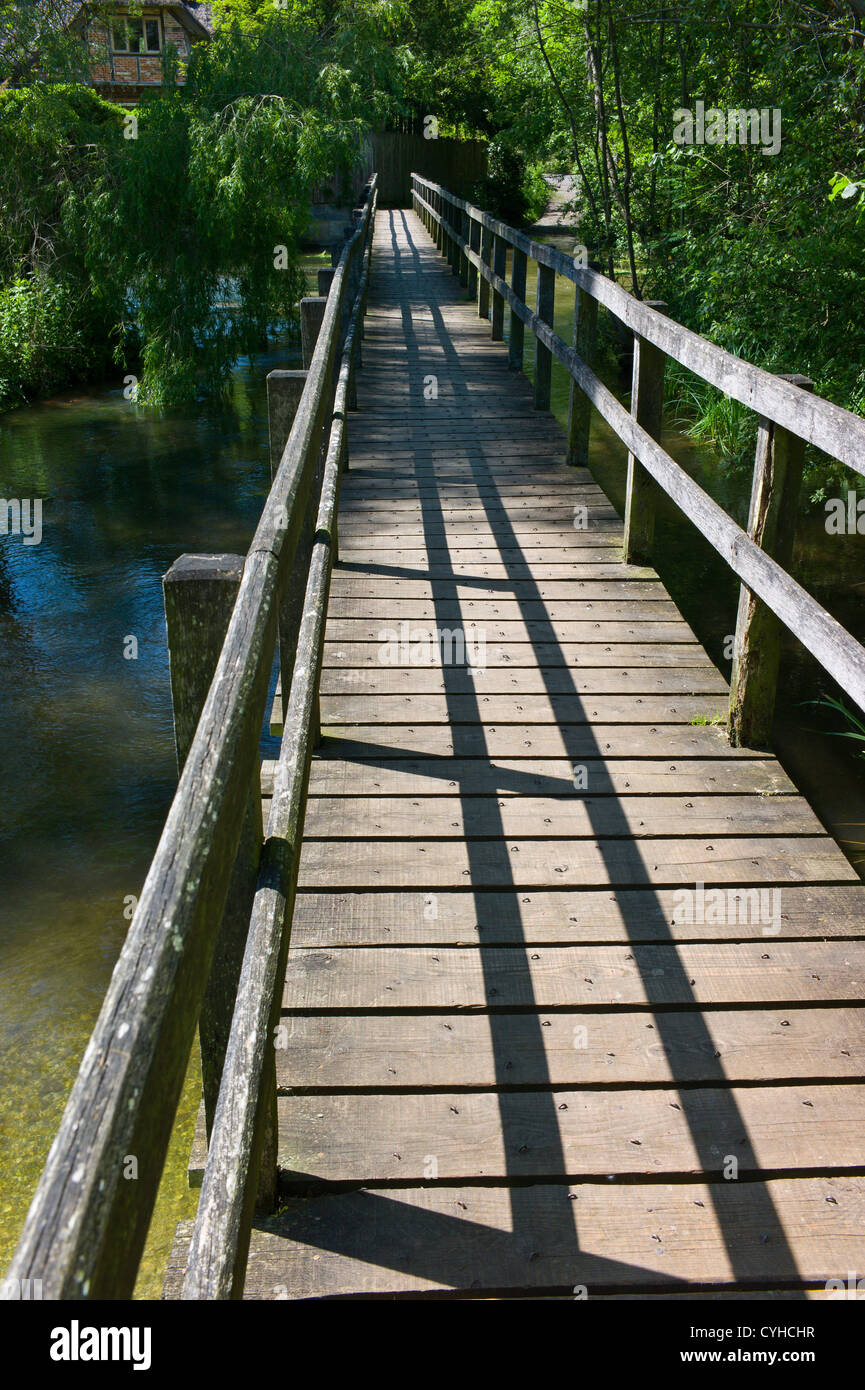 Footbridge across the River Test, a world renowned chalk stream at ...
