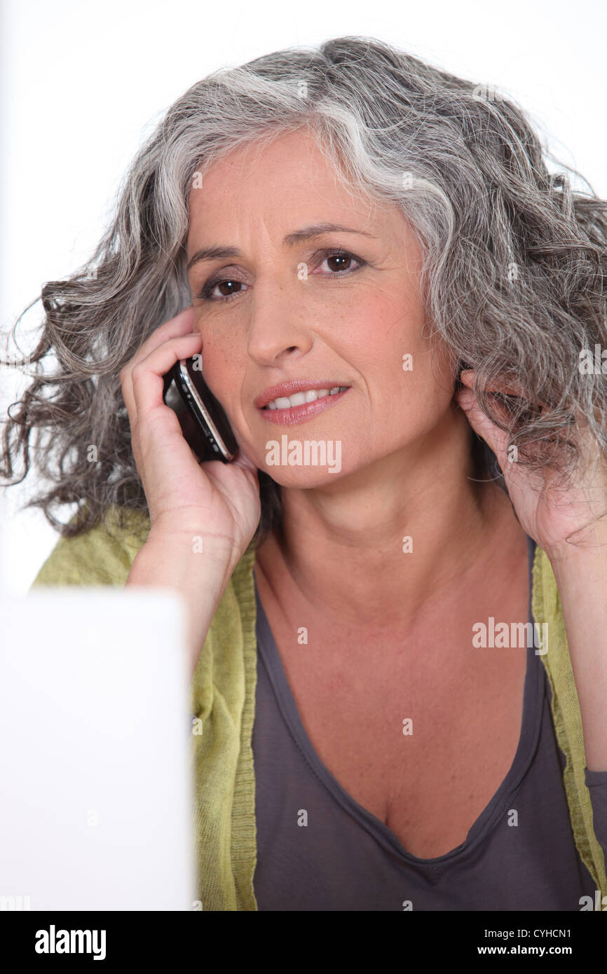 Senior lady making a call Stock Photo - Alamy