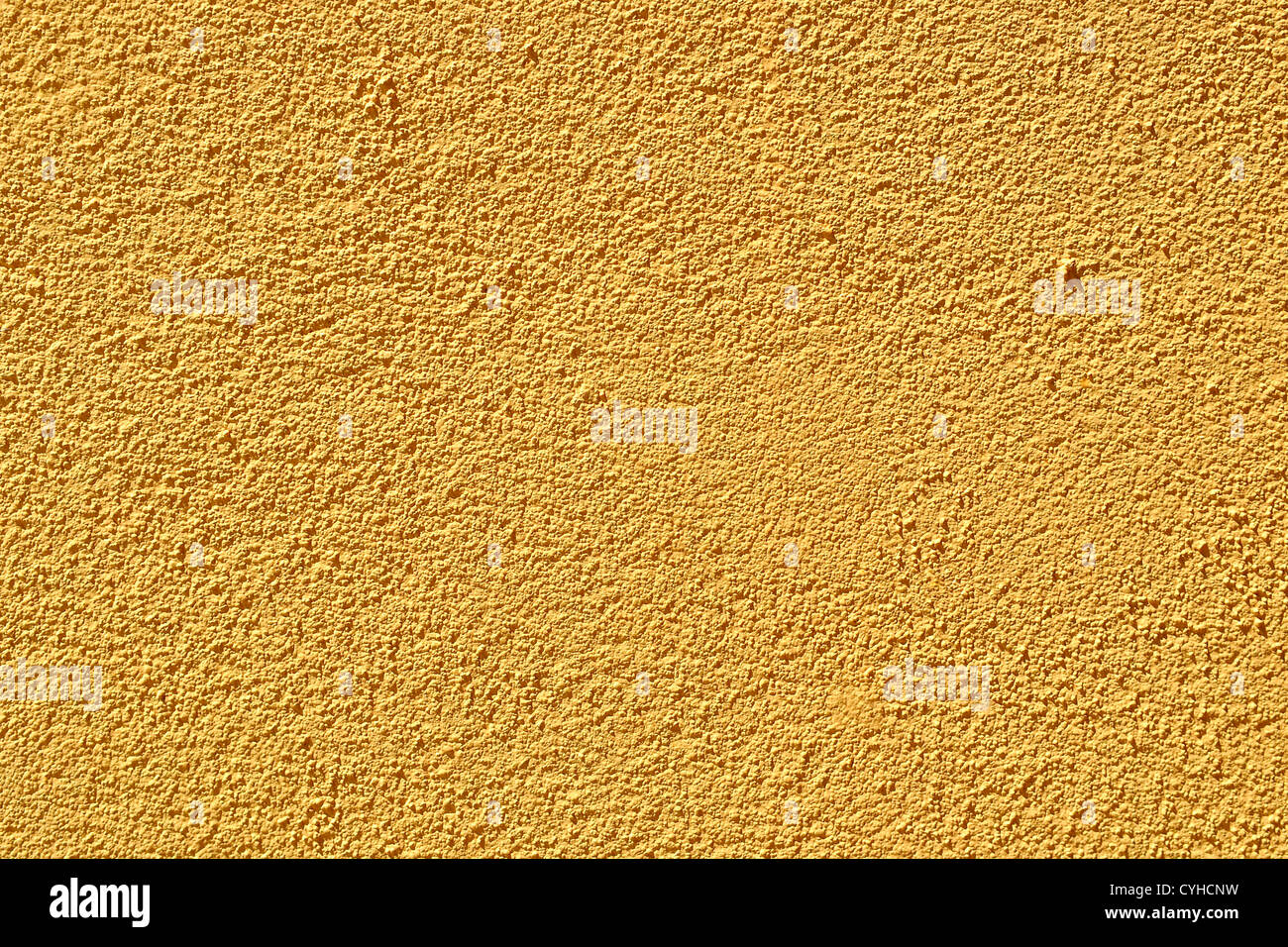 A yellow plaster wall texture / background Stock Photo - Alamy