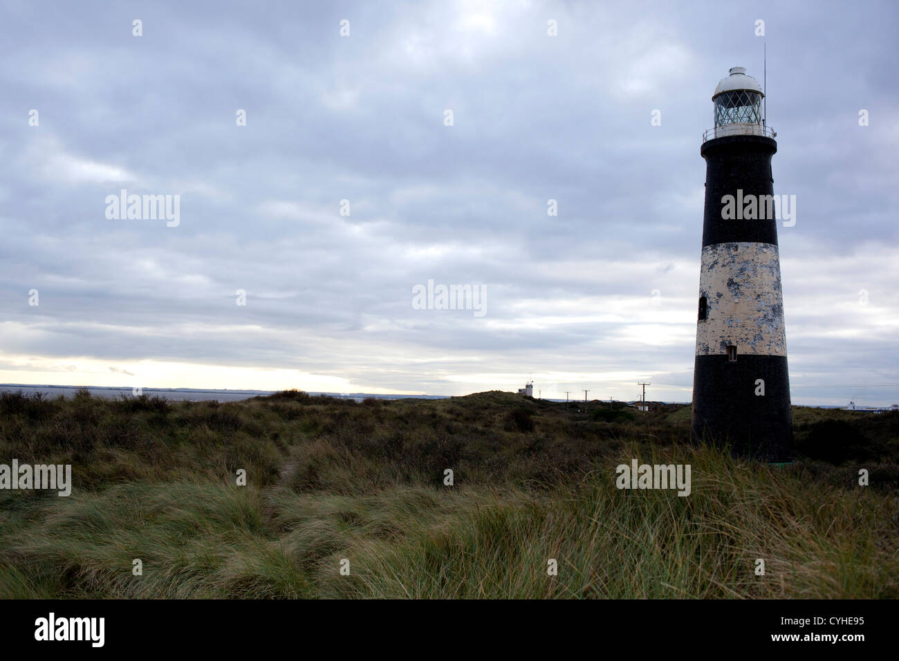 Spurn Point lighthouse set on a small strip of land on the end of the ...