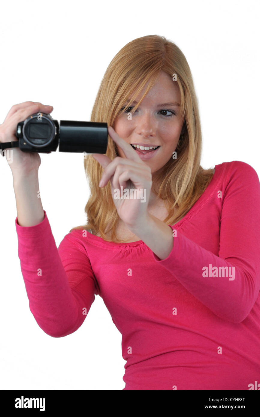 Woman filming with video camera Stock Photo - Alamy