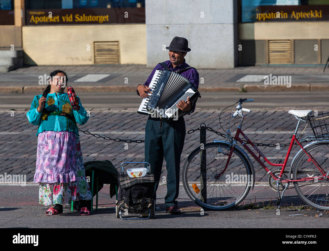 Old gypsy couple playing music on the streets of Helsinki, Finland ...