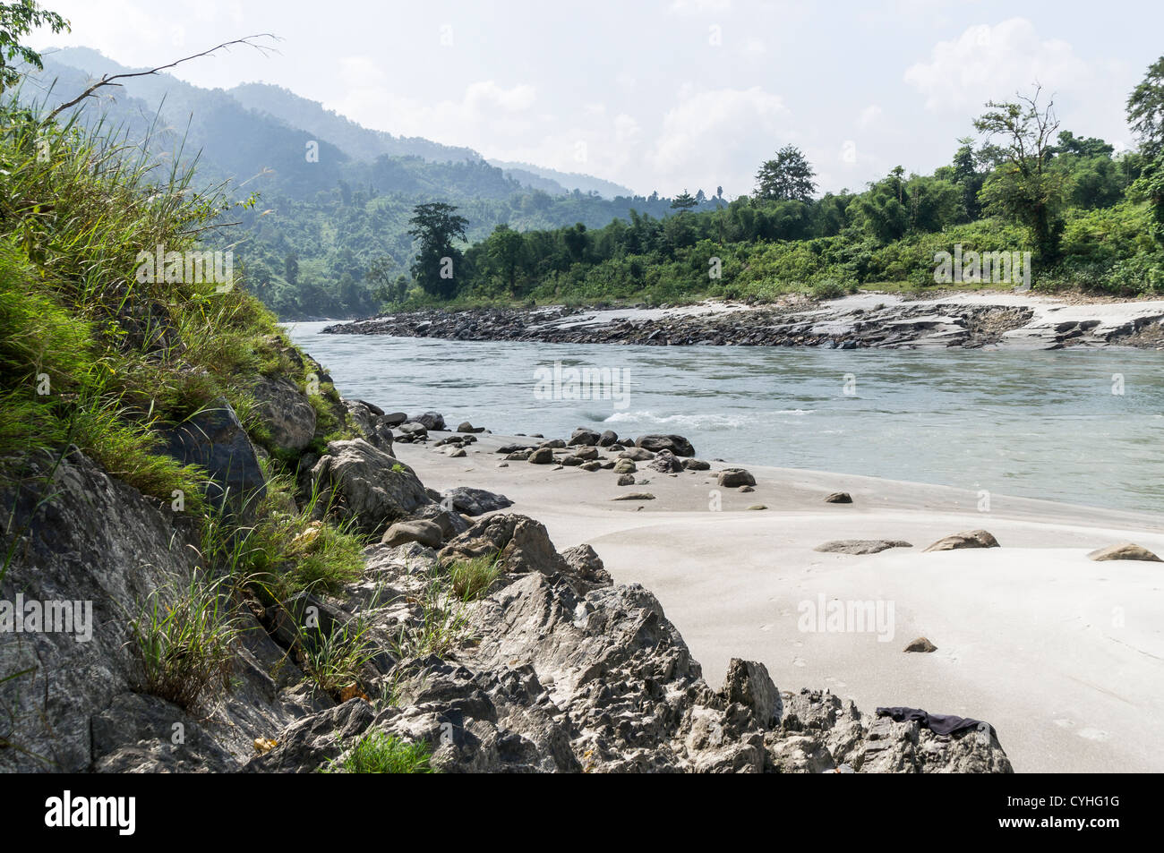 river in sun koshi, nepal with forest and small buildings Stock Photo ...