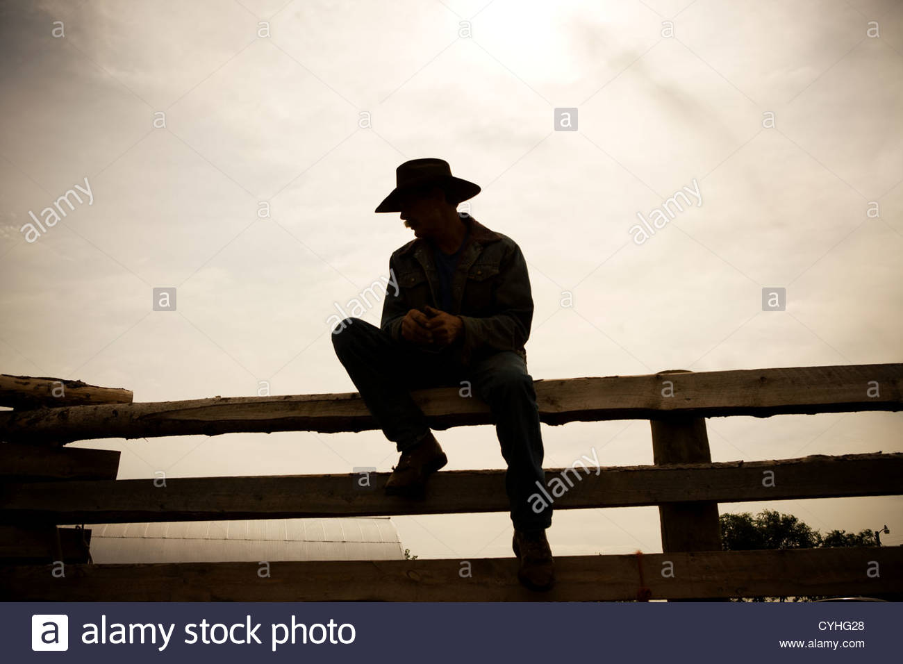 Cowboys Sitting On Fence Stock Photos & Cowboys Sitting On Fence Stock ...