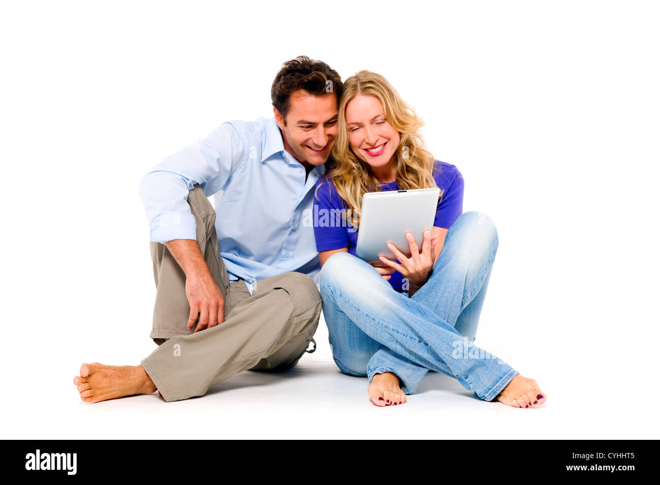couple using digital tablet Stock Photo - Alamy