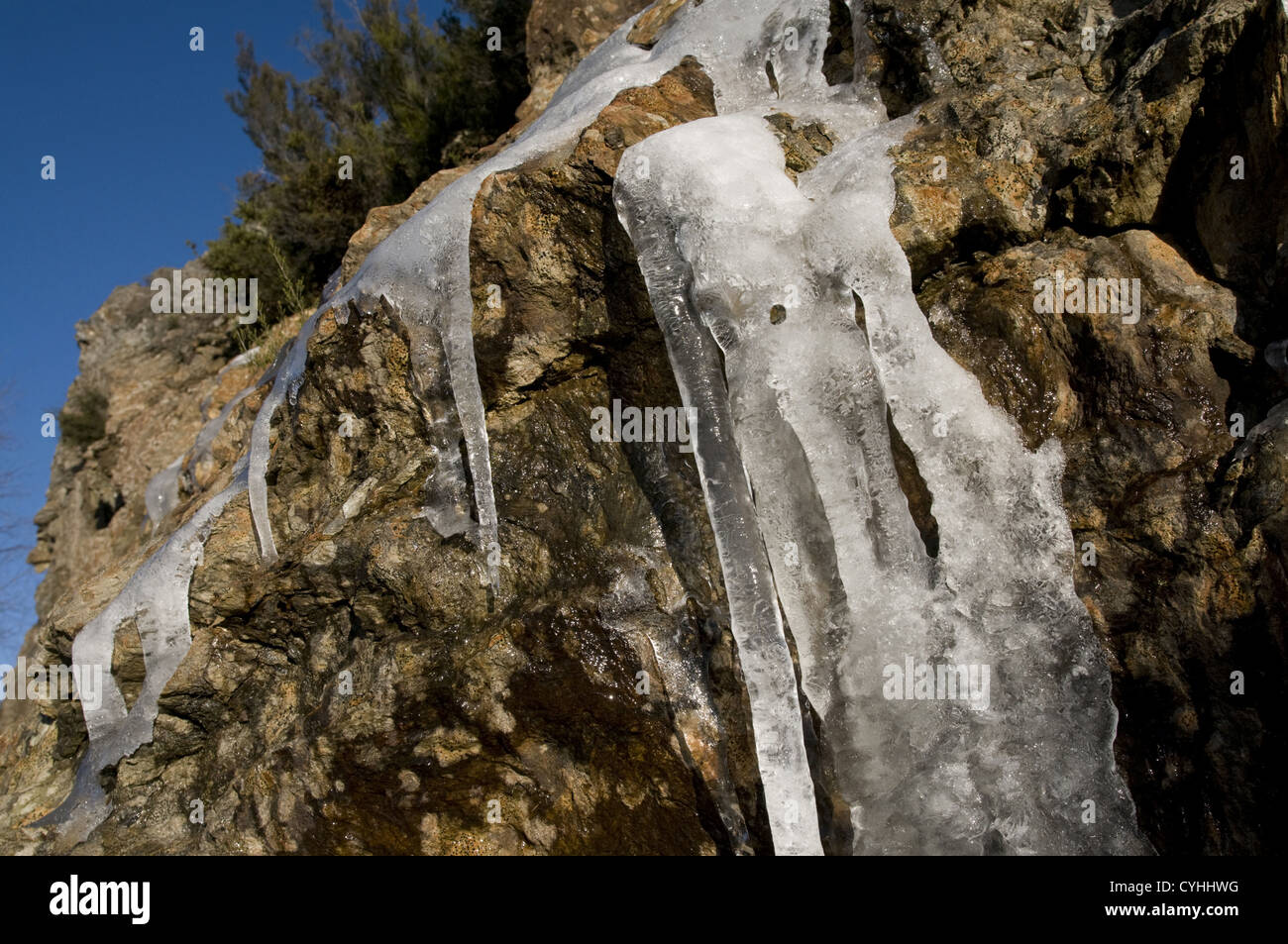 ice formation on the road side rock Stock Photo - Alamy