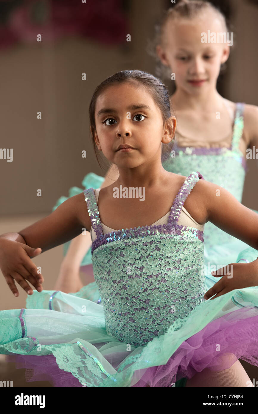 Two little girls in ballet dresses practice in a studio Stock Photo - Alamy