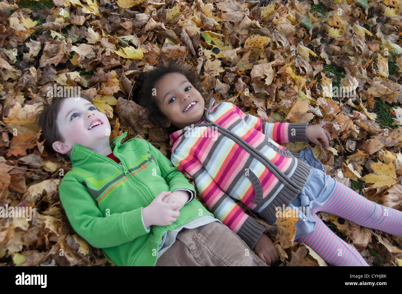 Multi-ethnic children autumn Stock Photo - Alamy