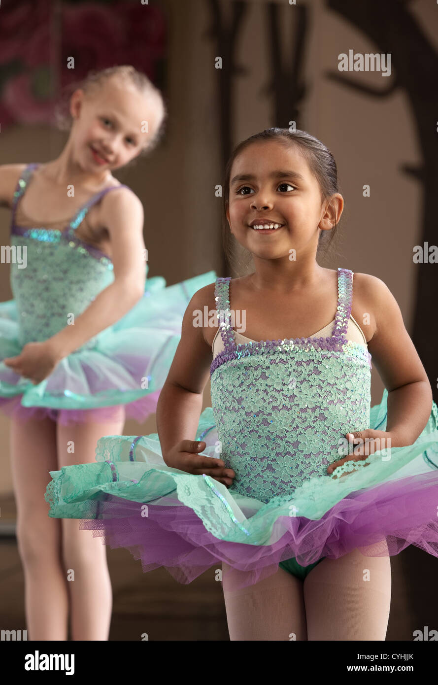Two little ballet students practicing while laughing Stock Photo - Alamy