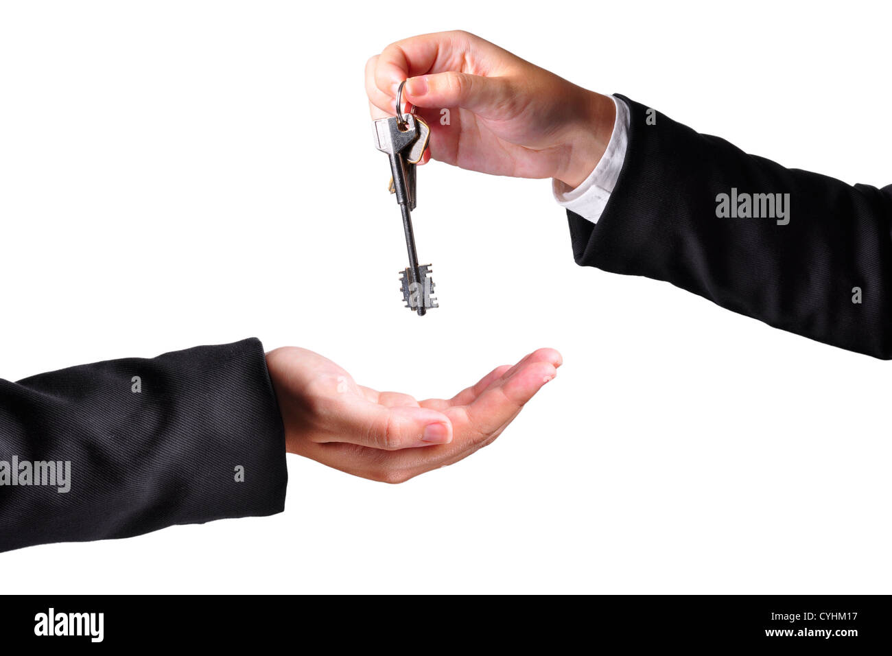 A hand giving a key to another hand. Both persons in suits. Isolated ...
