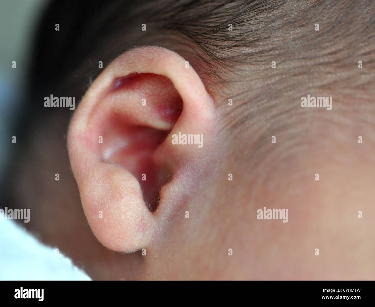 Closeup of a newborn's ear. Very shallow depth of field Stock Photo - Alamy
